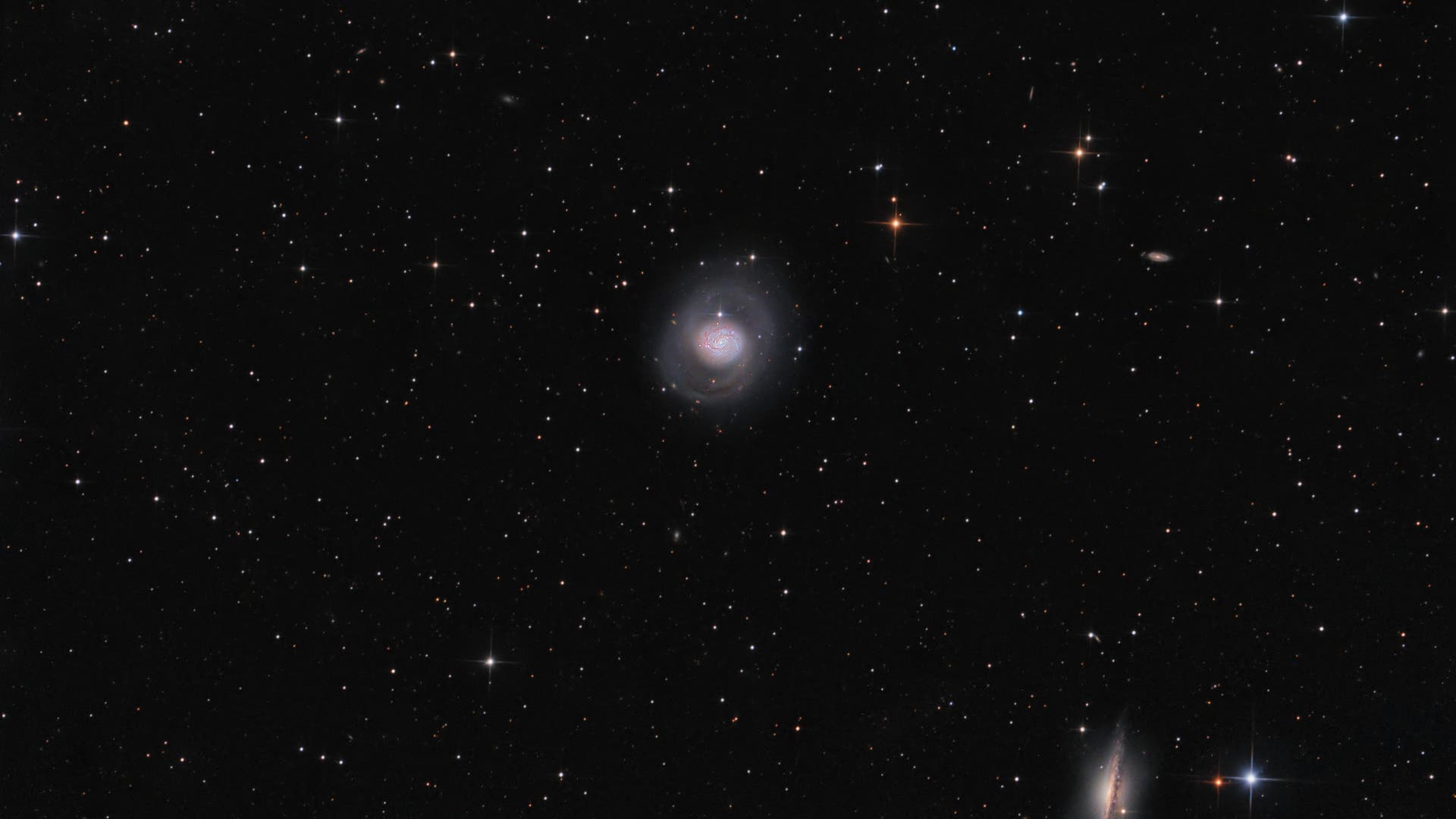 Messier 77 und NGC1055 - Spektrum der Wissenschaft